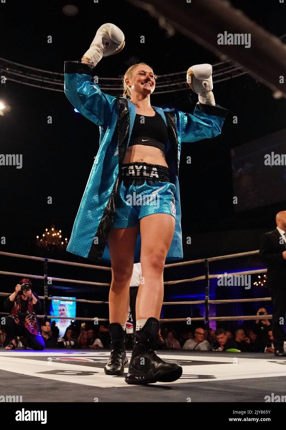 Tayla Harris enters the ring as she fights Janay Harding compete in the ...