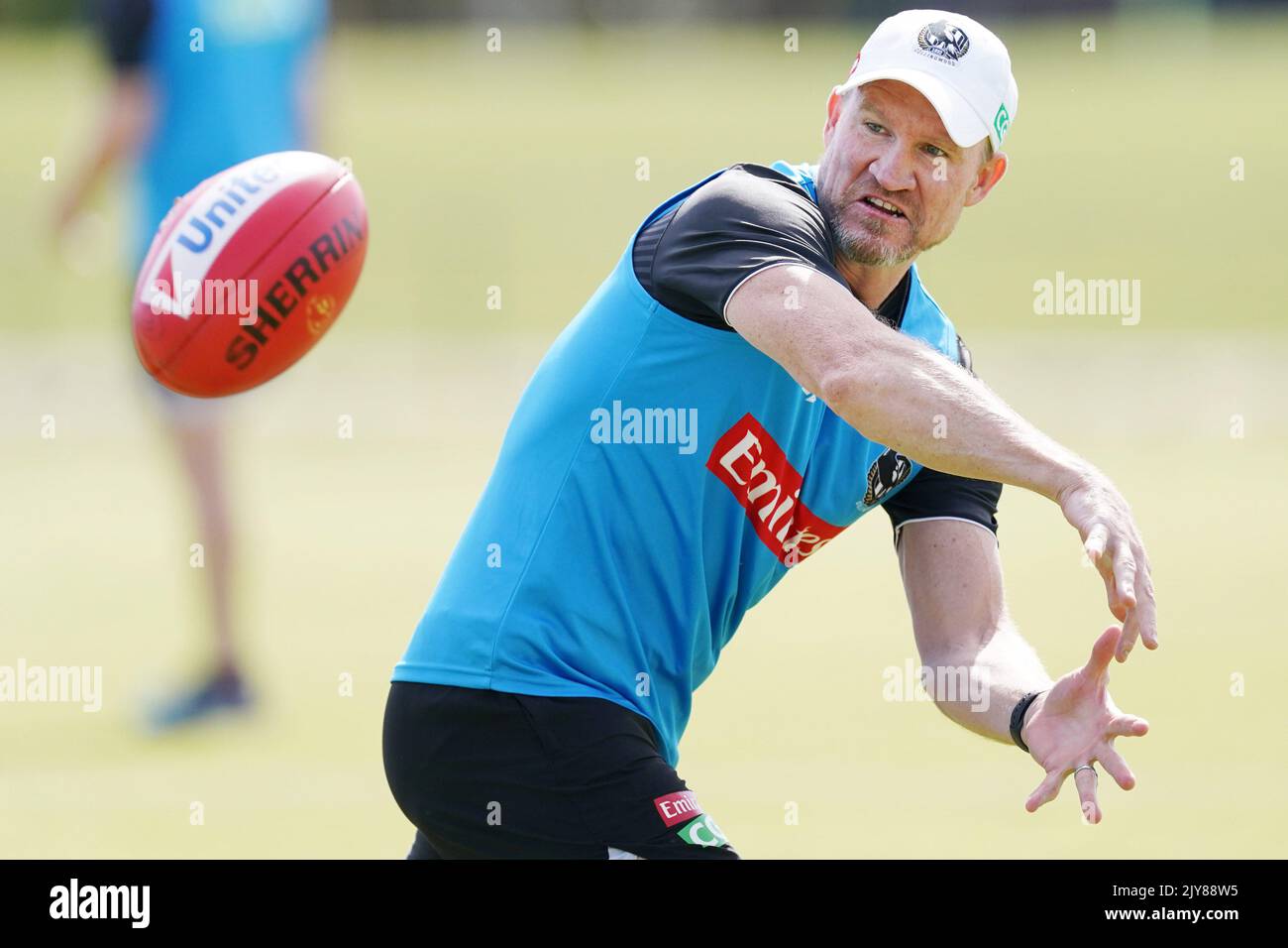 Magpies head coach Nathan Buckley marks the ball during a Collingwood ...