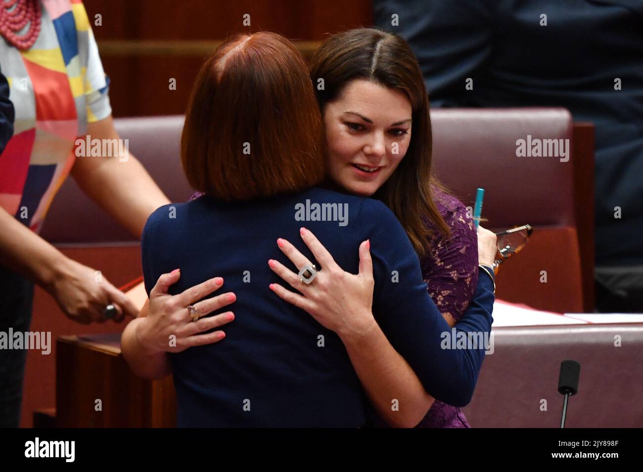 Greens Senator Sarah Hanson-Young (R) is hugged by Greens Senator ...