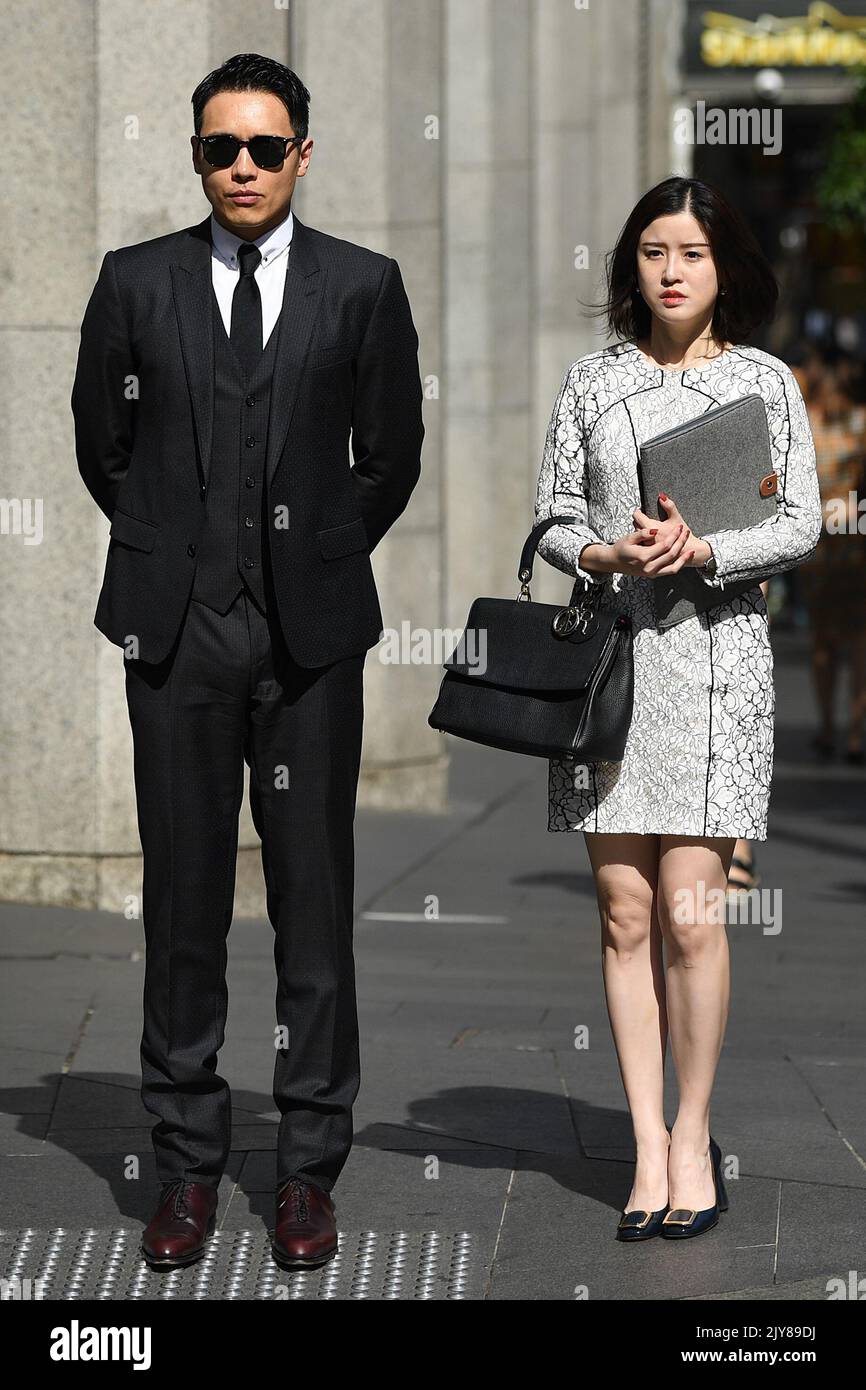 Yunxiang Gao (left) arrives at the Downing Centre Court in Sydney ...