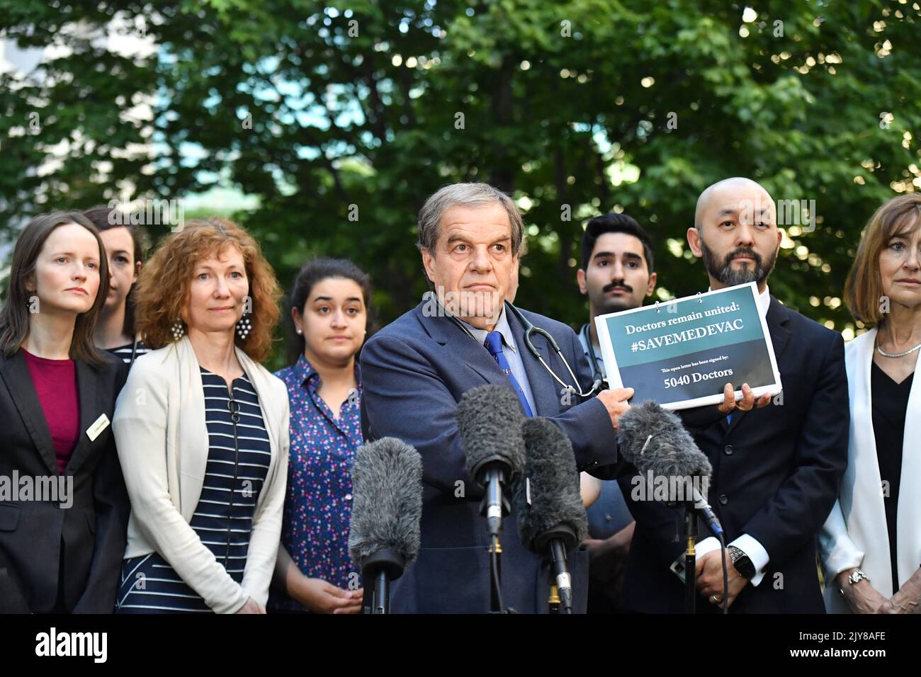 Paediatrician Professor David Isaacs (C) and 13 colleagues at a press ...