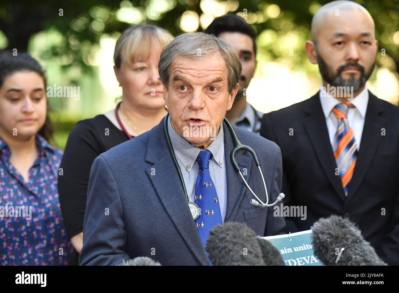 Paediatrician Professor David Isaacs (C) and 13 colleagues at a press ...