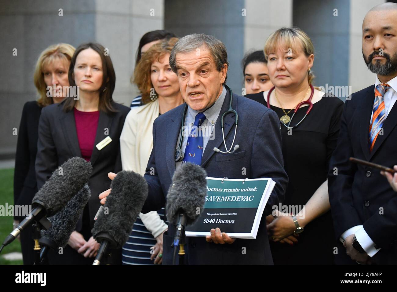Paediatrician Professor David Isaacs (C) and 13 colleagues at a press ...