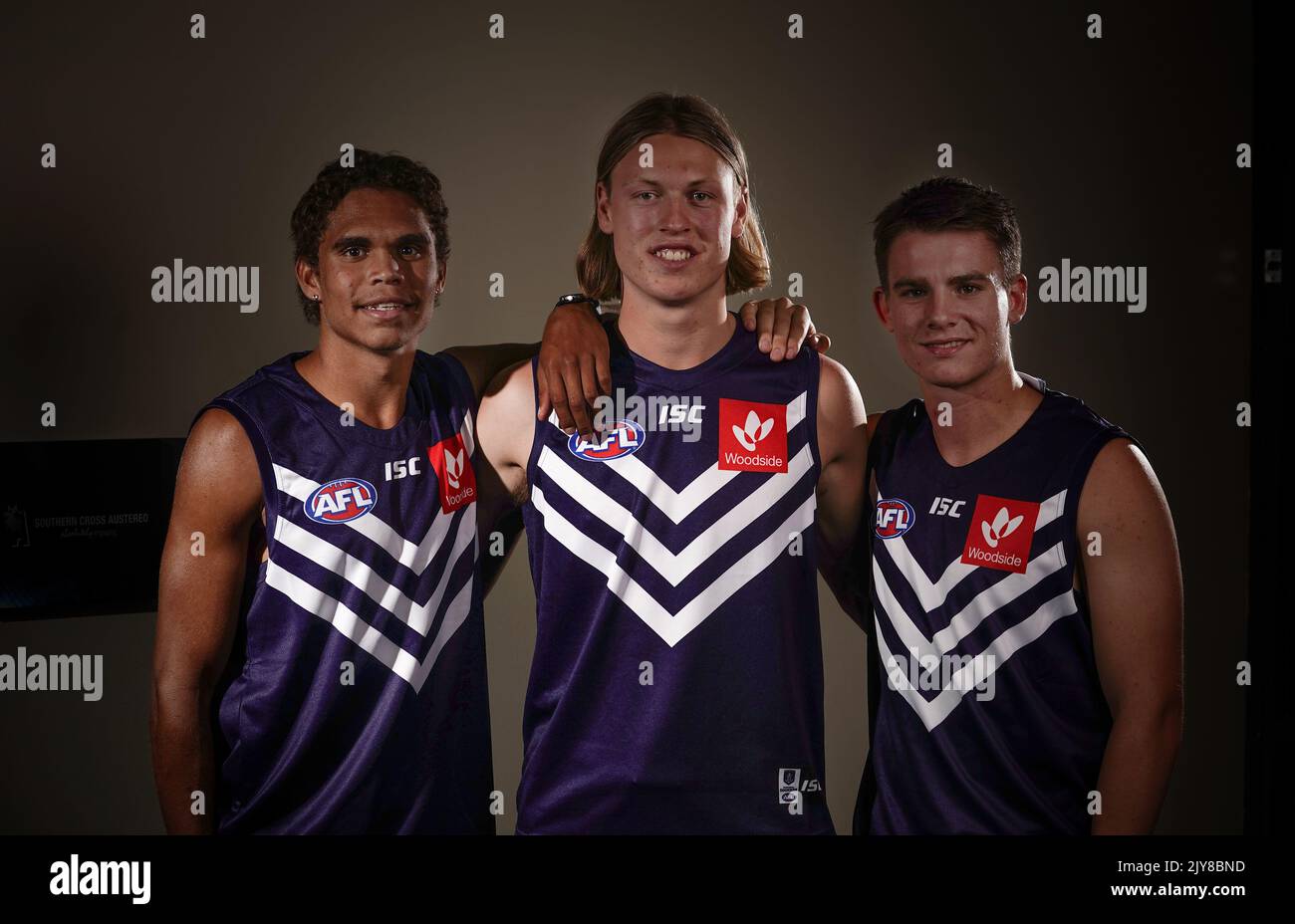 Liam Henry, Hayden Young, and Caleb Serong of the Fremantle Dockers ...