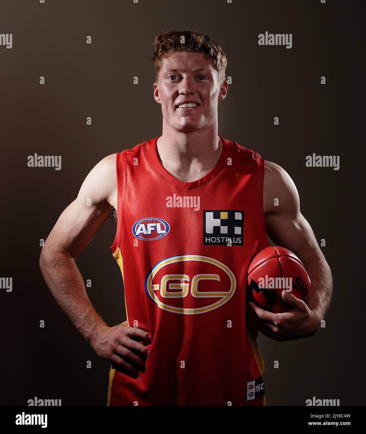 Number 1 draft pick Matthew Rowell of the Gold Coast Suns poses for a ...