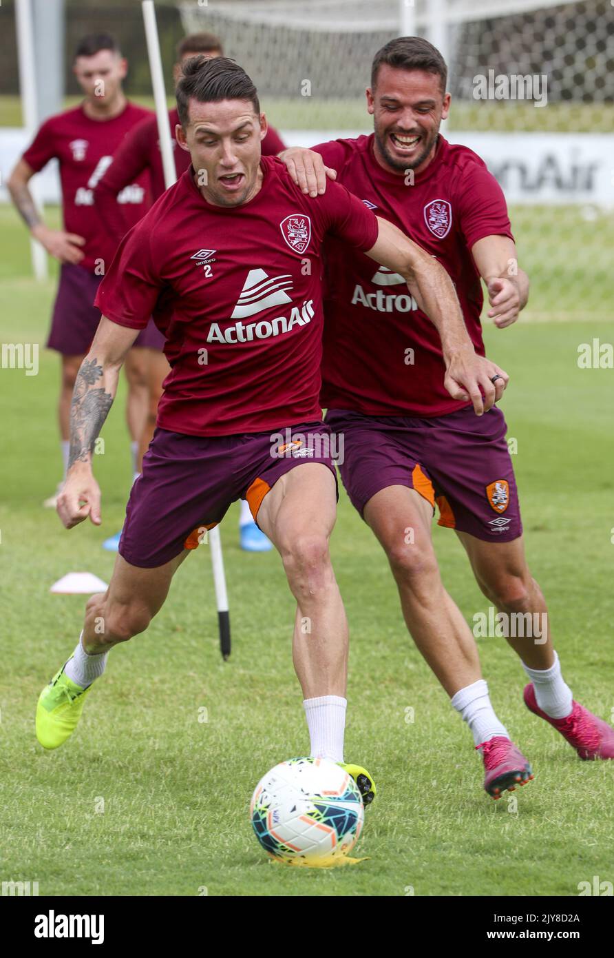 L-R, Scott Neville and Bradden Inman of the Roar compete for the ball ...