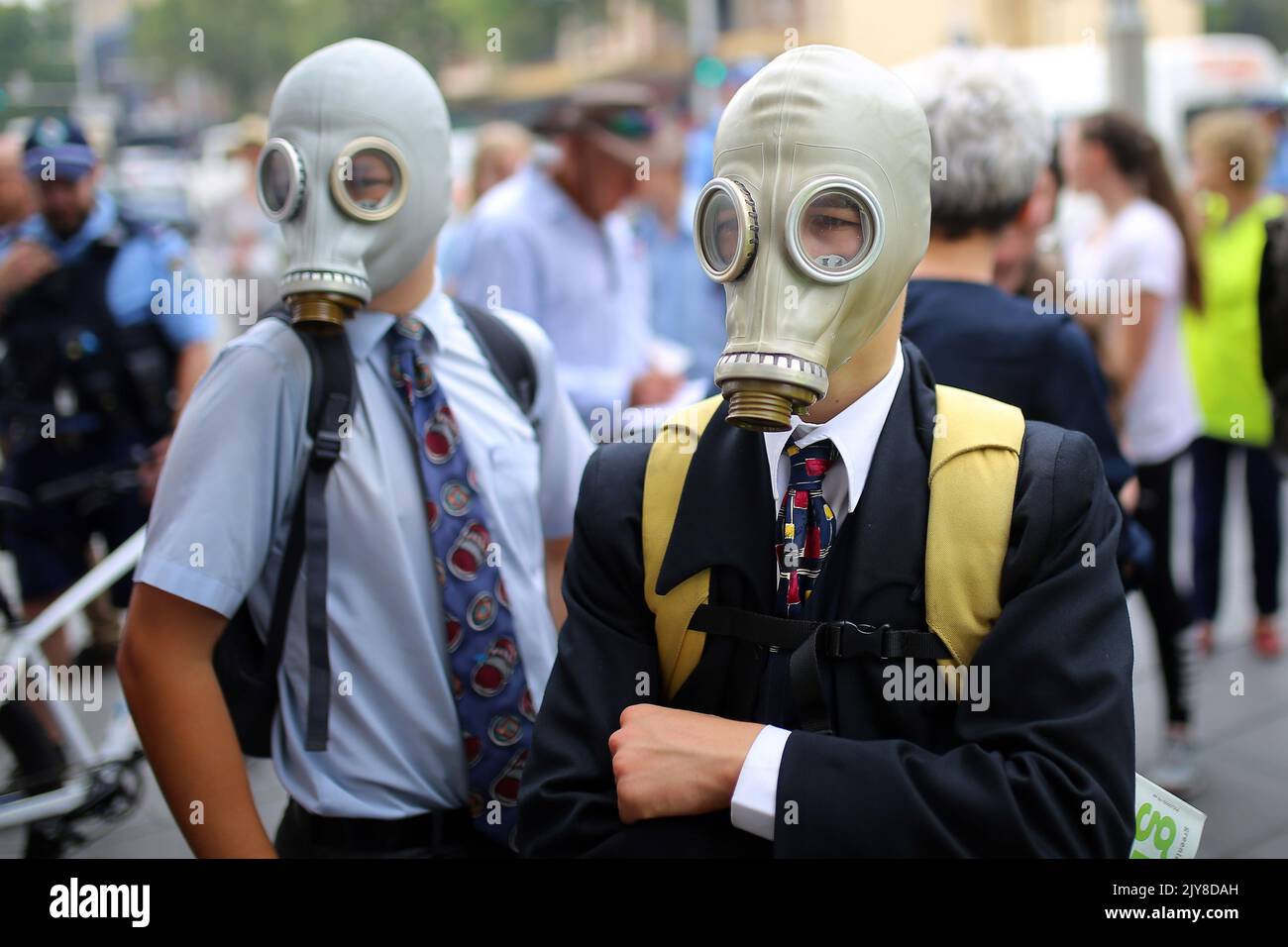 Student activists wear gas masks during a School Strike for Climate ...
