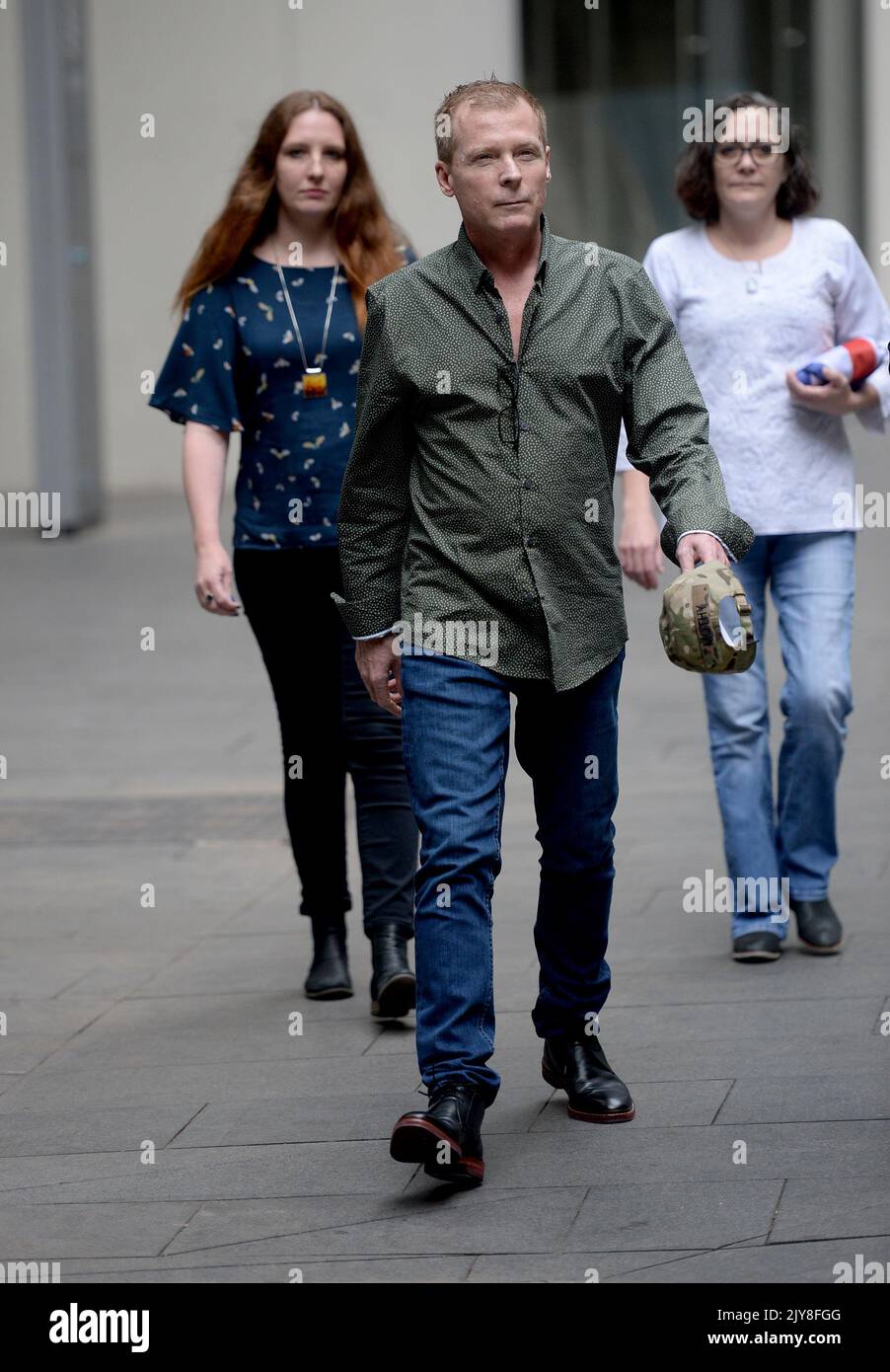 Australian academic Timothy Weeks arrives for a press conference with ...