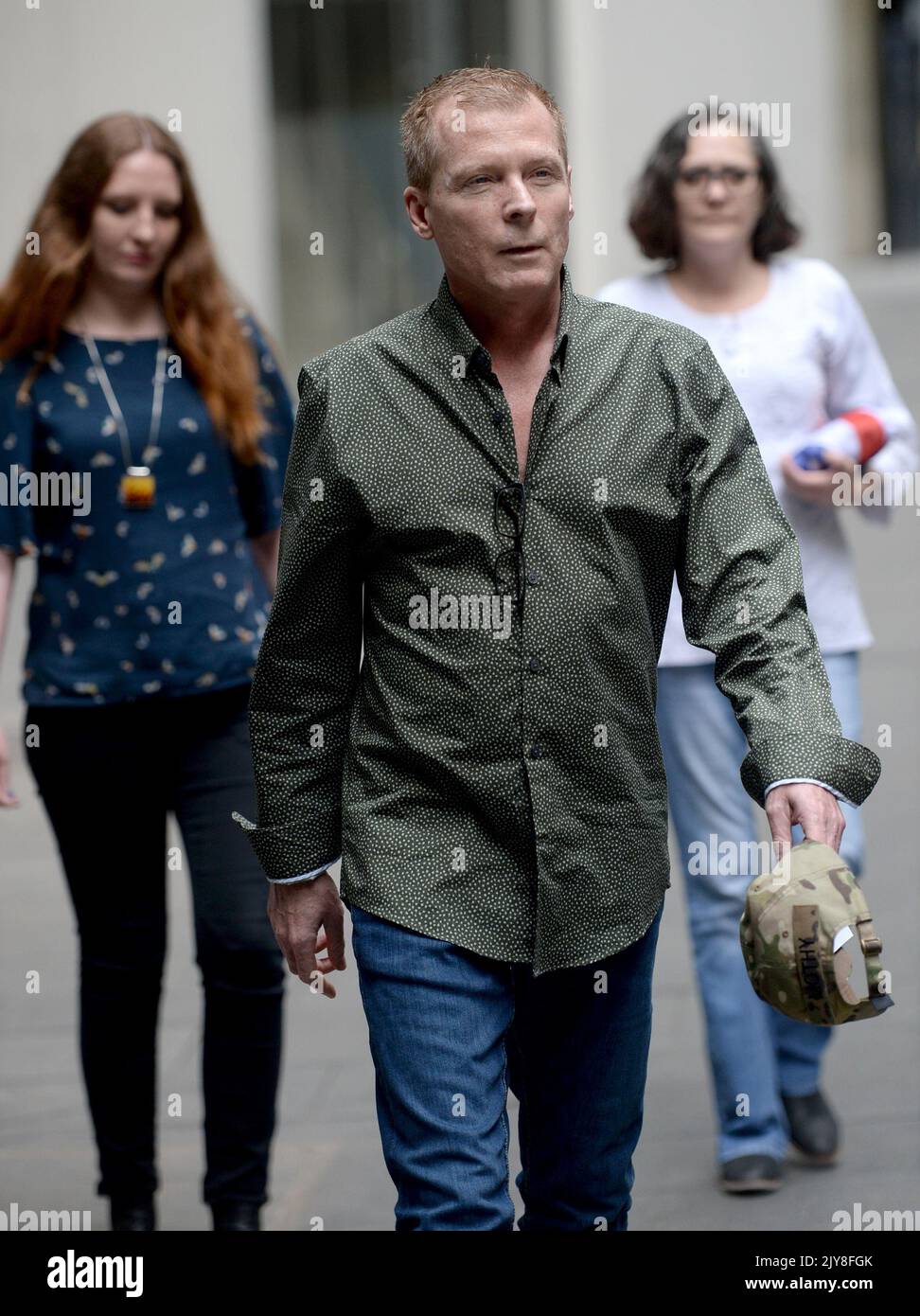 Australian academic Timothy Weeks arrives for a press conference with ...