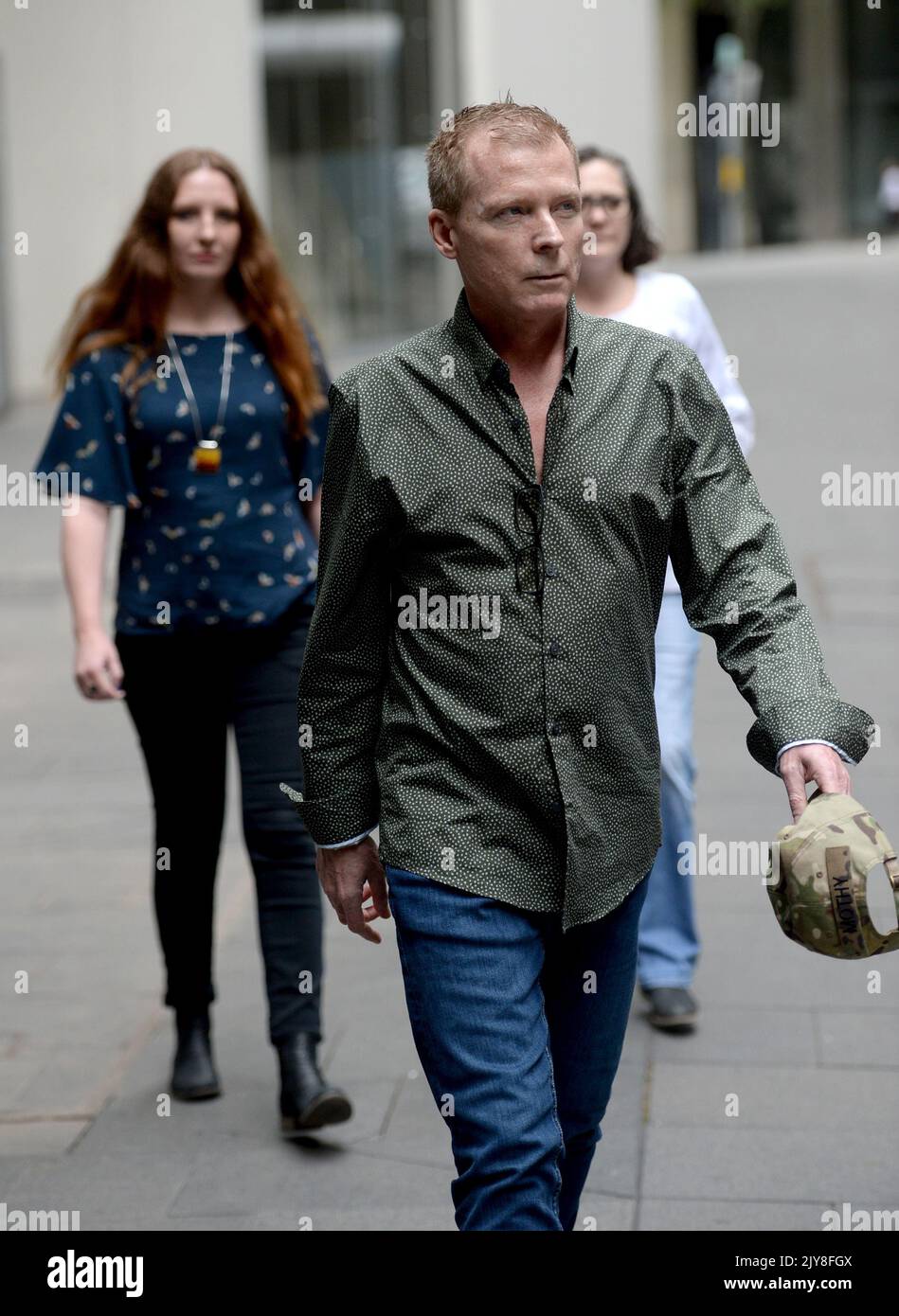 Australian academic Timothy Weeks arrives for a press conference with ...