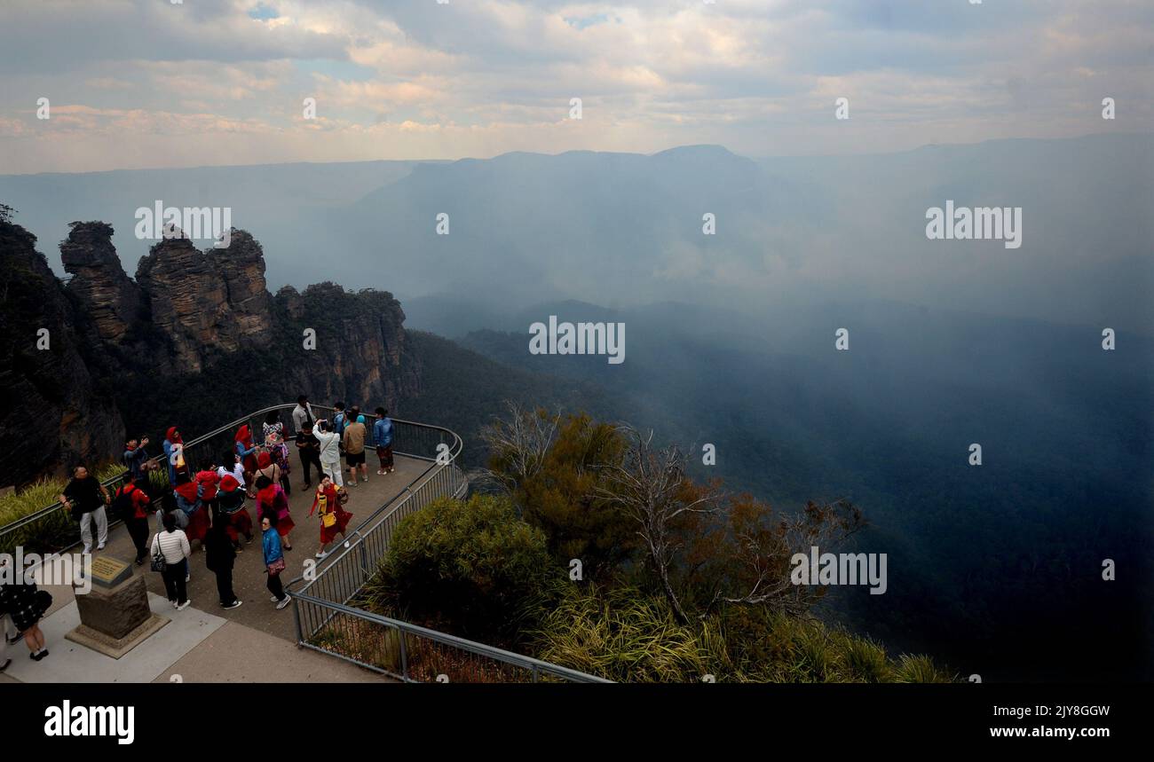 Smoke is seen as a fire continues to burn in Katoomba, Blue Mountains ...