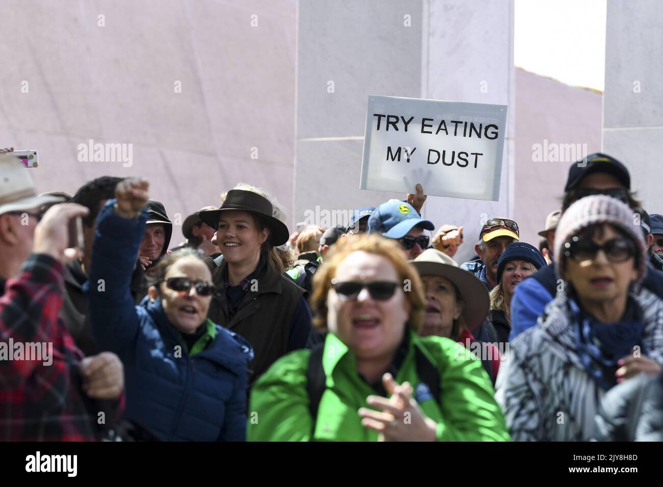 Farmers hold up signs as they attend the 'Can the Murray-Darling Basin ...