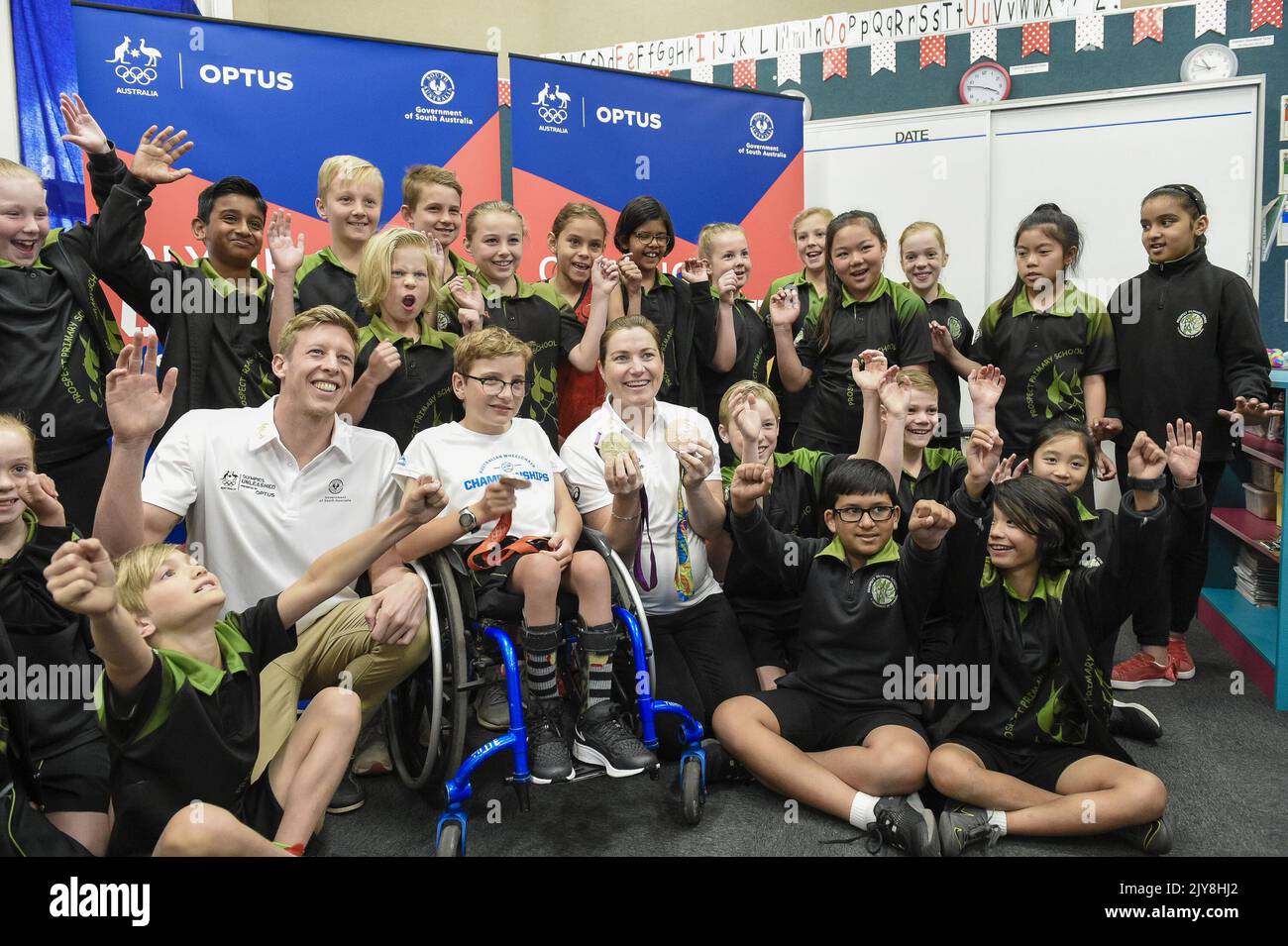 Swimmer Travis Mahoney and cyclist Anna Meares are seen with students ...