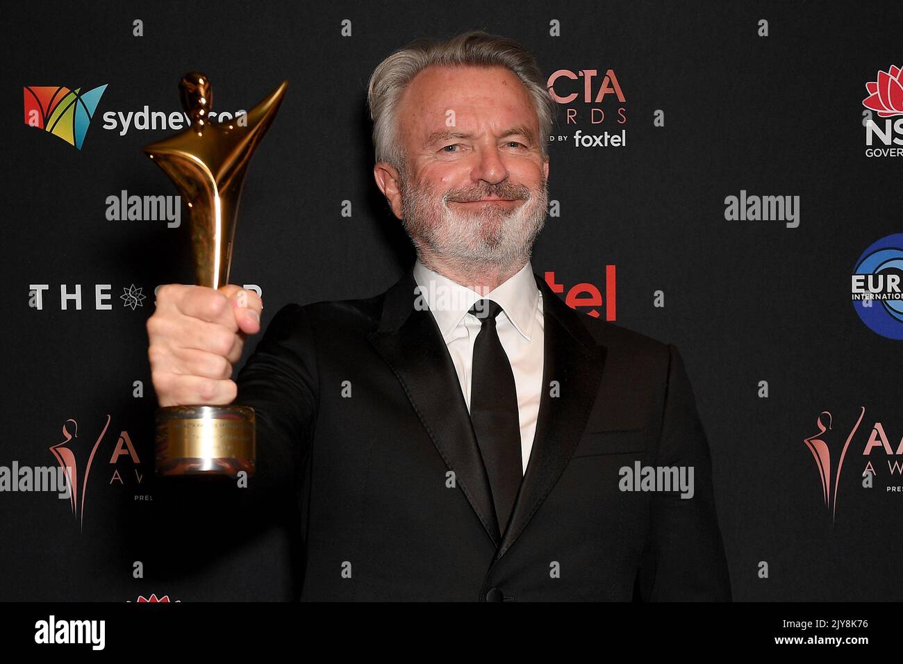 Sam Neill poses for a photograph after winning the Longford Lyell Award ...
