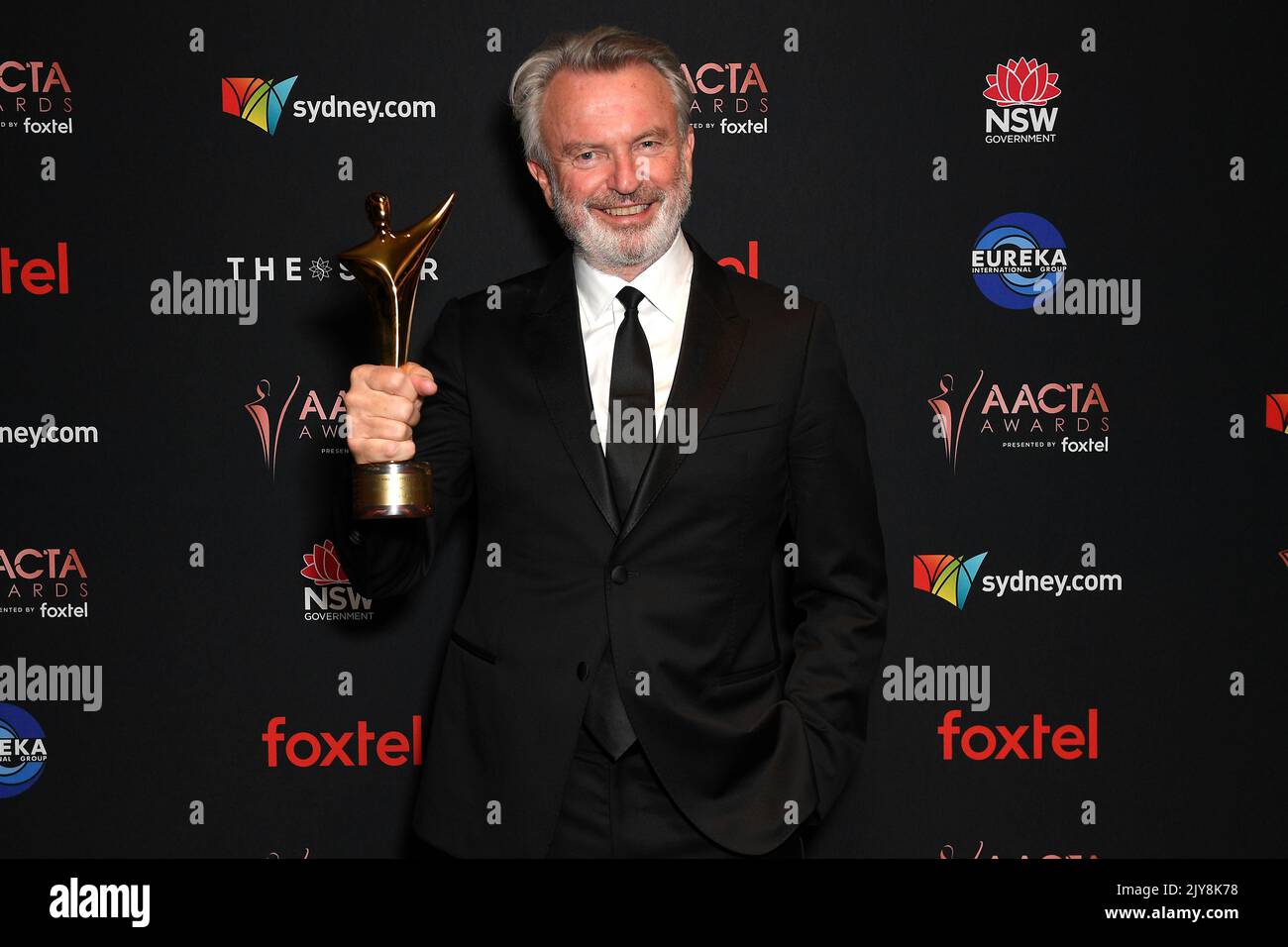 Sam Neill poses for a photograph after winning the Longford Lyell Award ...