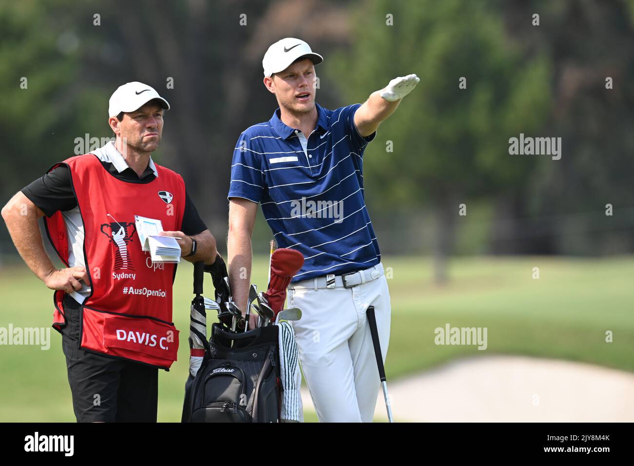 Cameron Davis of Australia discusses his shot with his caddy on the ...