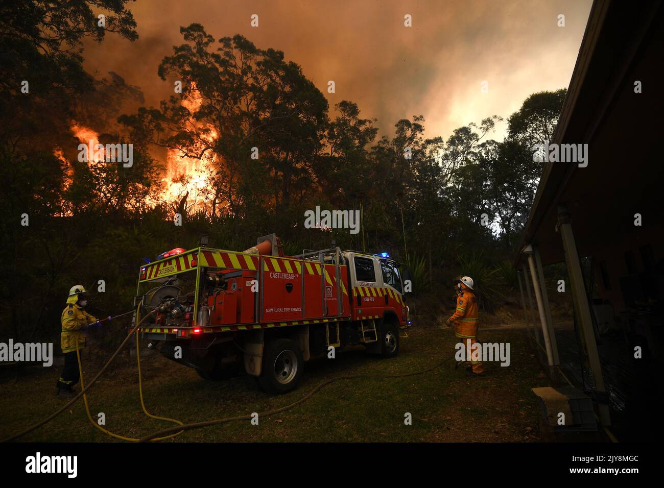 NSW Rural Fire Service and Fire and Rescue NSW crews work to protect a ...