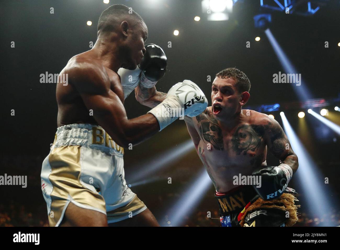 Bruno Tarimo and Nathaniel May compete in the Men's Super Featherweight fight during their ...