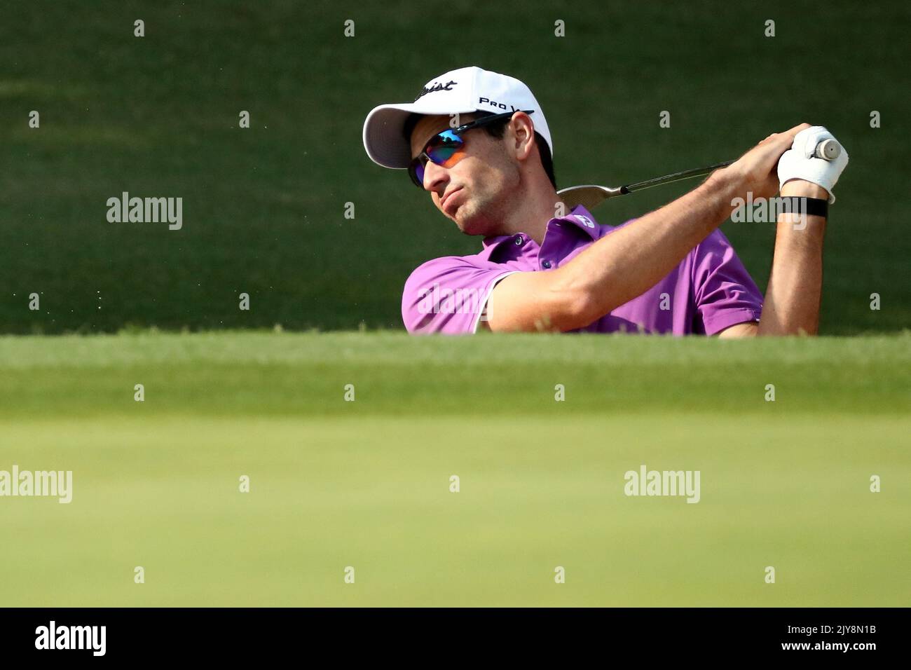 Jordan Zunic of Australia hits the ball from the bunker on the 1st hole ...