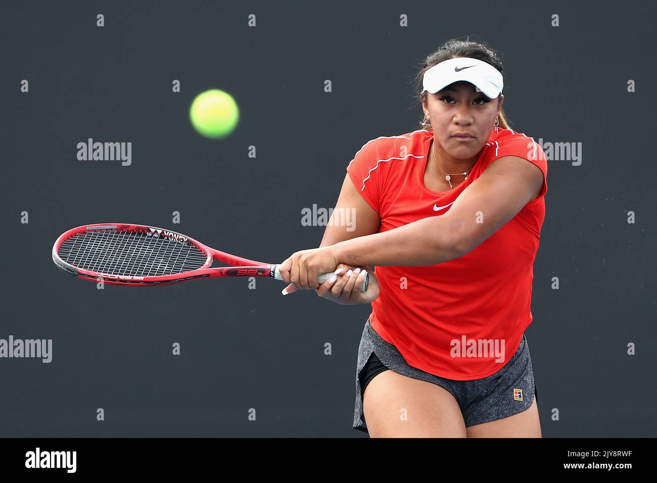 Destanee Aiava of Australia plays a backhand during her doubles match ...