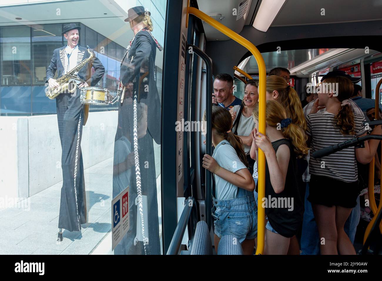 Passengers are seen onboard the new light rail after it was officially ...