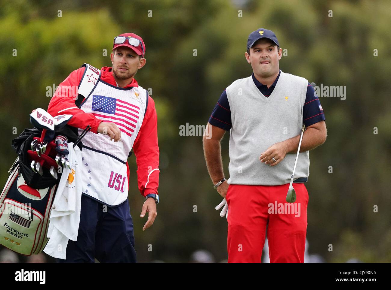 Patrick Reed of the United States team and his caddie Kessler Karain ...