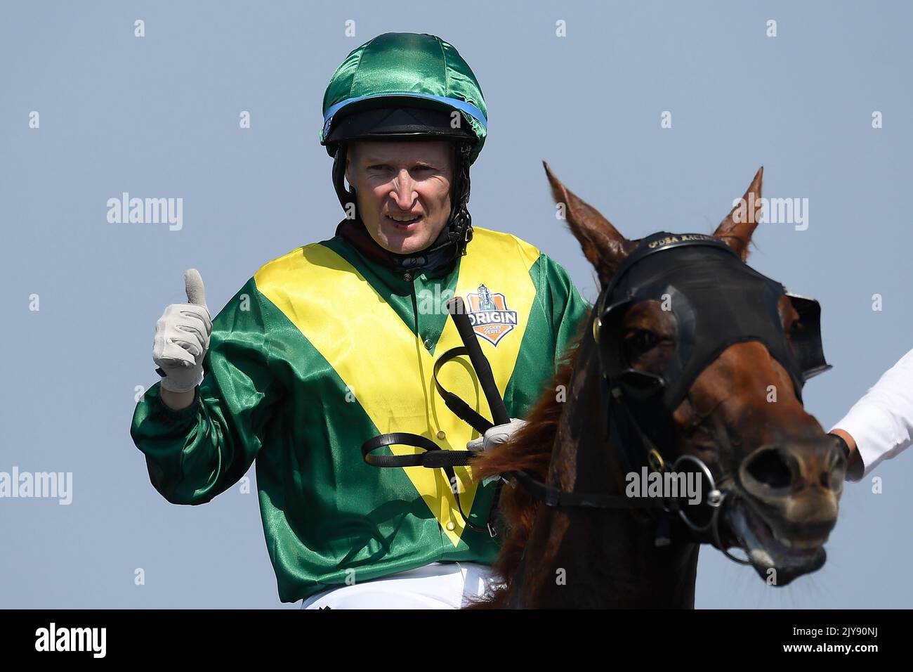 Jockey Craig Newitt gestures after riding Jeweliana to victory in race ...