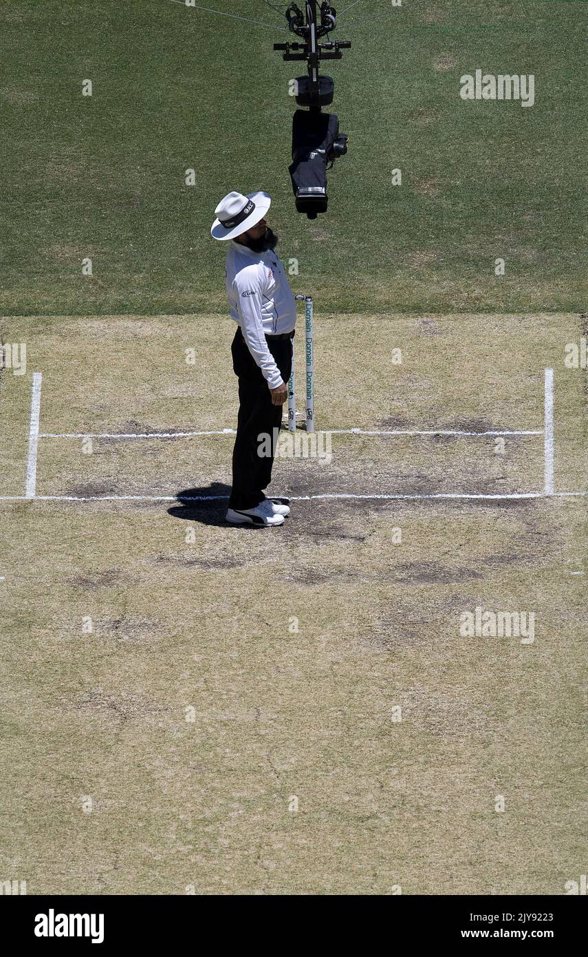 Umpire Aleem Dar looks into the spider-camera after inspecting the ...