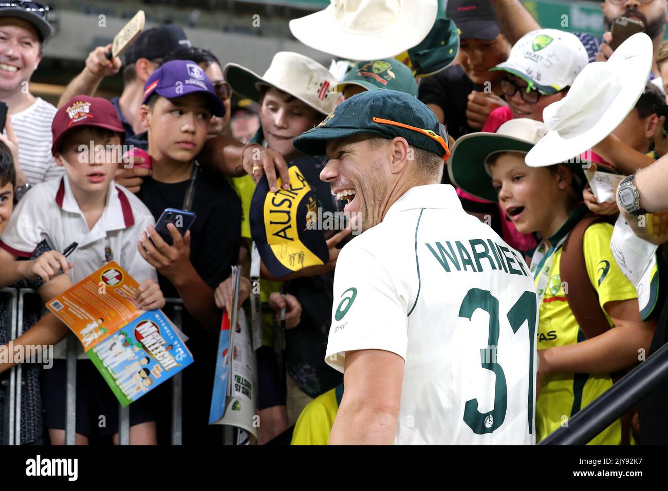 David Warner of Australia signs autographs after winning on day 4 of ...