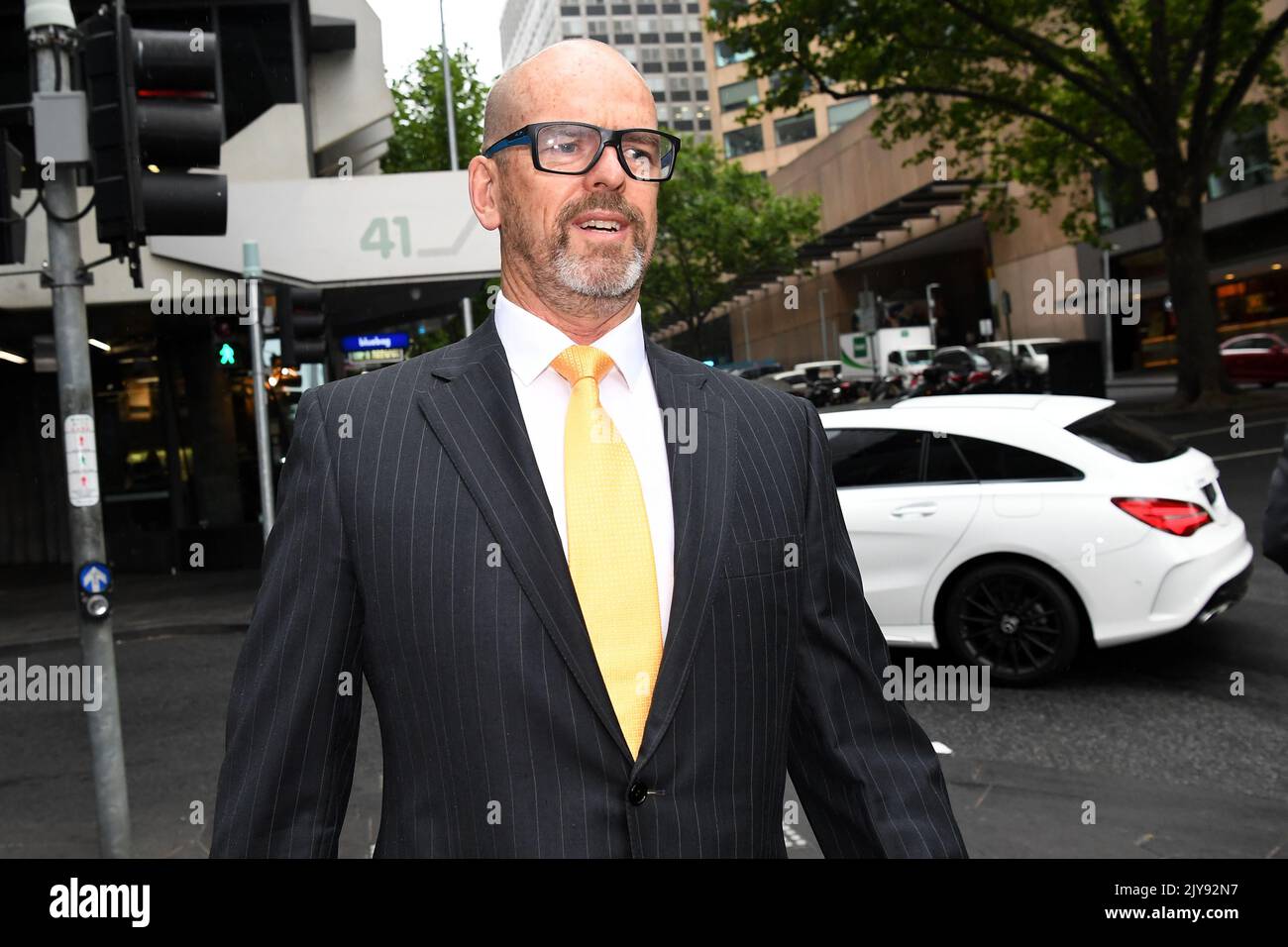 Former Victoria Police Chief Commissioner Simon Overland arrives to the ...