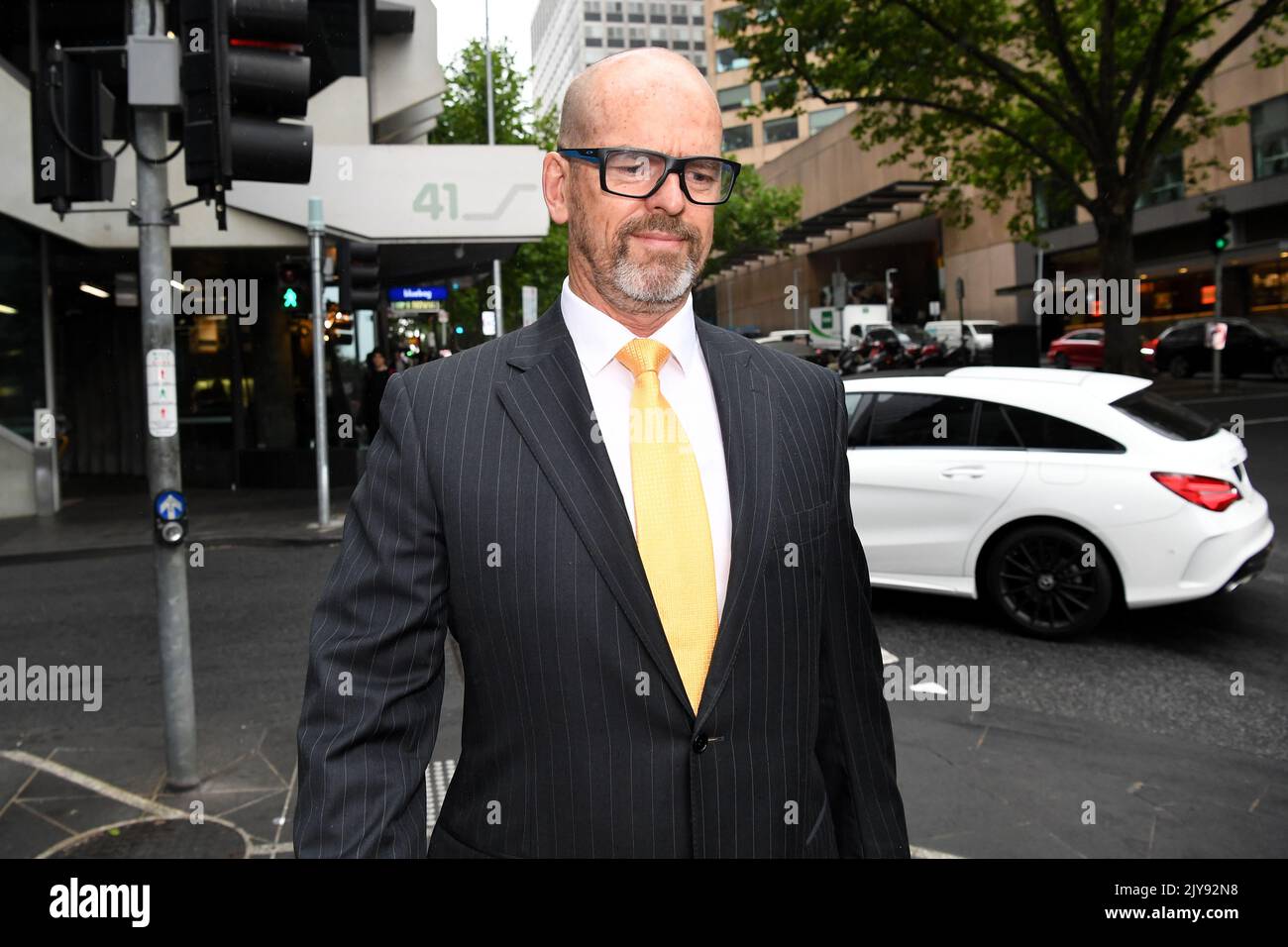 Former Victoria Police Chief Commissioner Simon Overland arrives to the ...