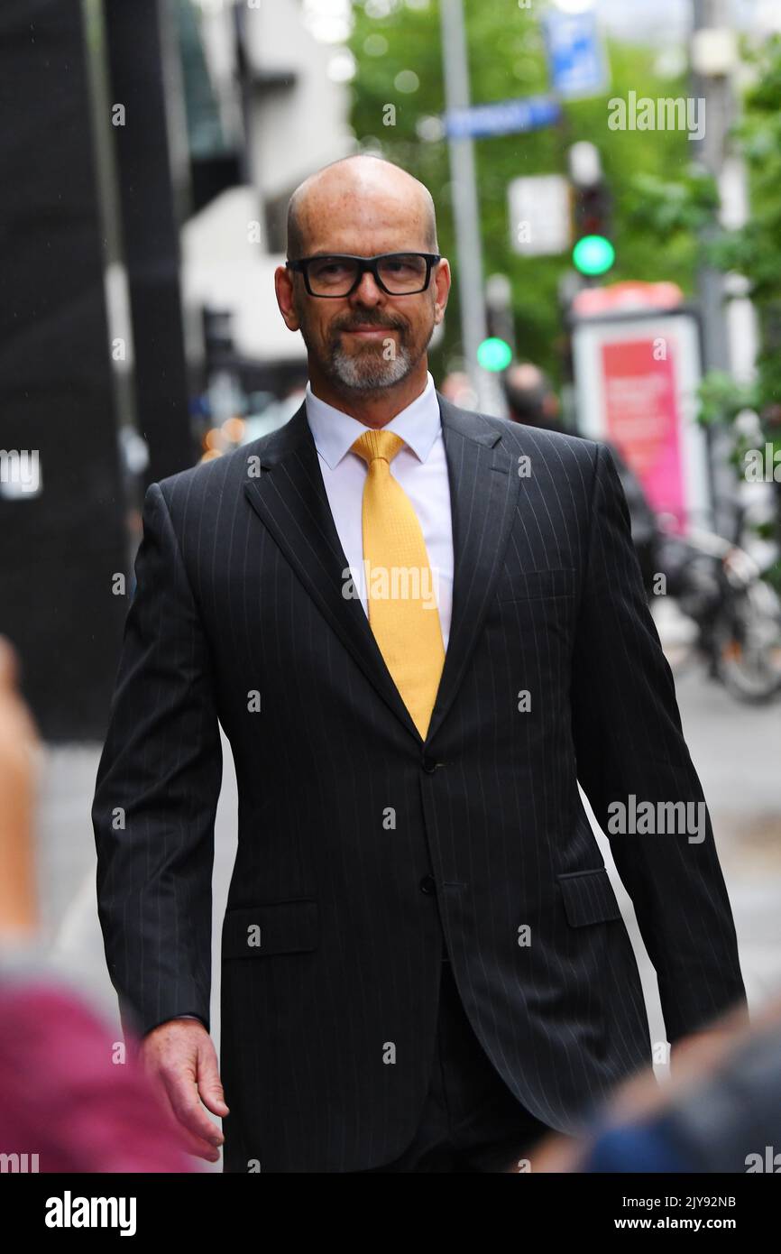 Former Victoria Police Chief Commissioner Simon Overland arrives to the ...