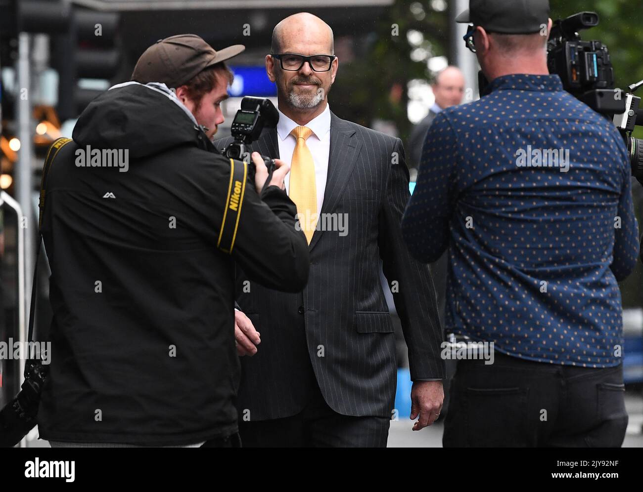 Former Victoria Police commissioner Simon Overland (centre) arrives at ...