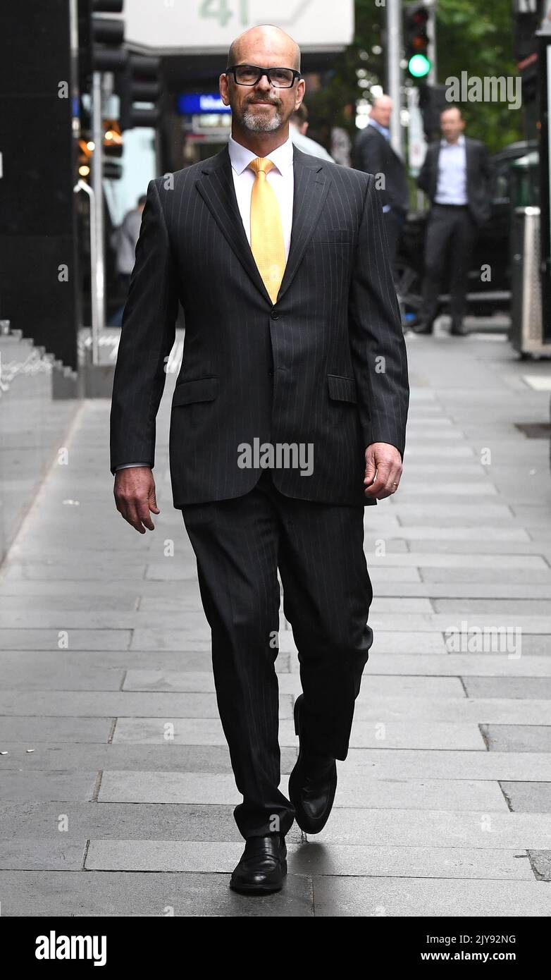 Former Victoria Police commissioner Simon Overland arrives at the Royal ...