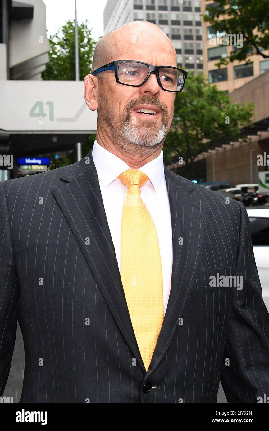 Former Victoria Police Chief Commissioner Simon Overland arrives to the ...