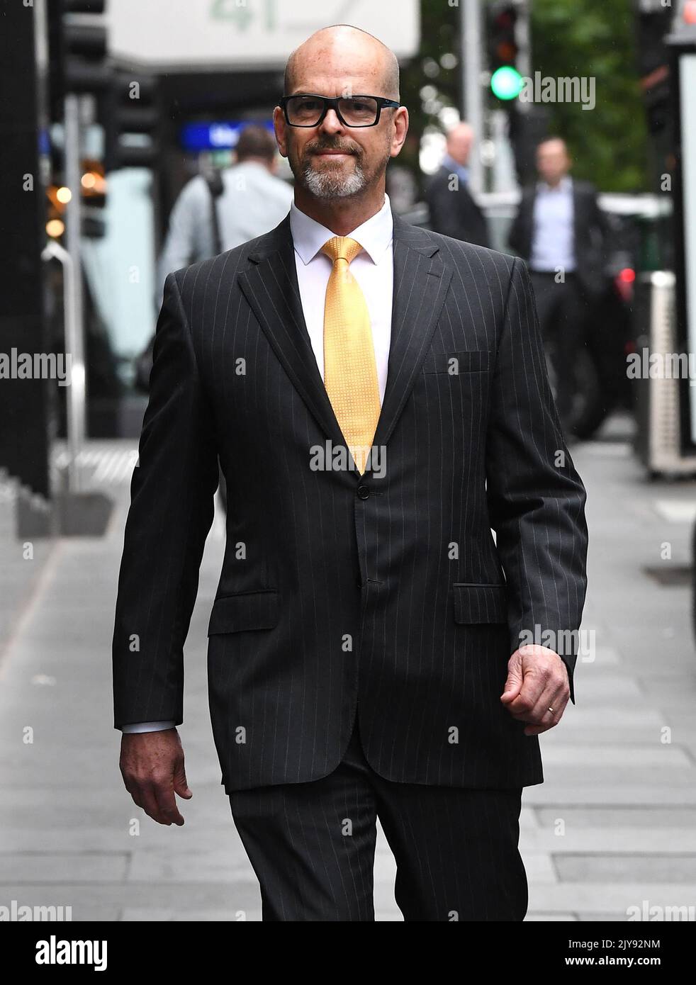 Former Victoria Police commissioner Simon Overland arrives at the Royal ...