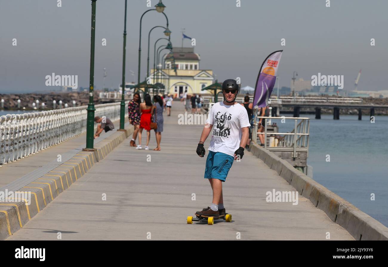 People flock to St Kilda beach and foreshore area as a heat wave sweeps ...