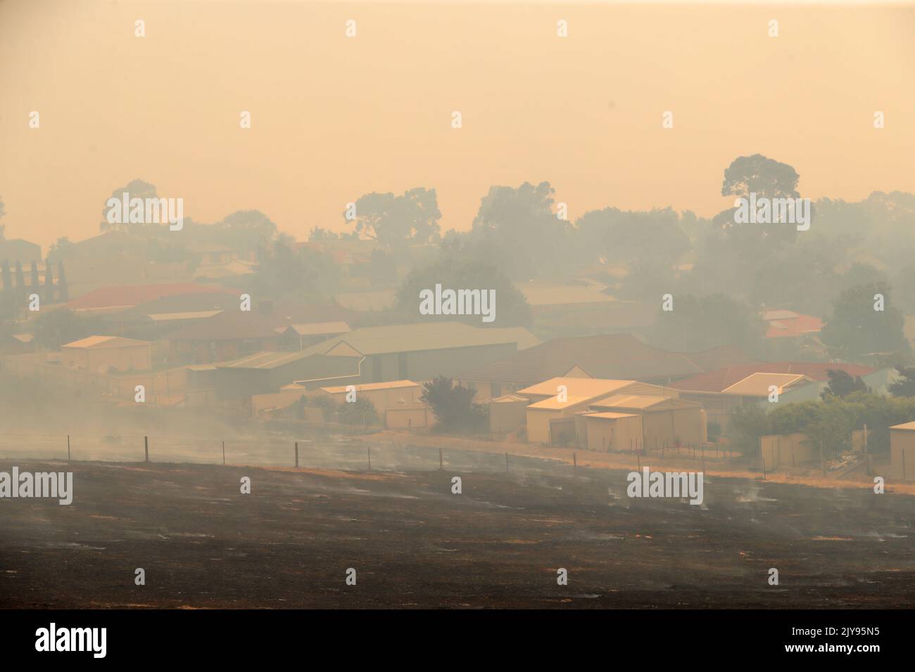Smoke from the Cuddle Creek fire is seen over Woodside in the Adelaide ...