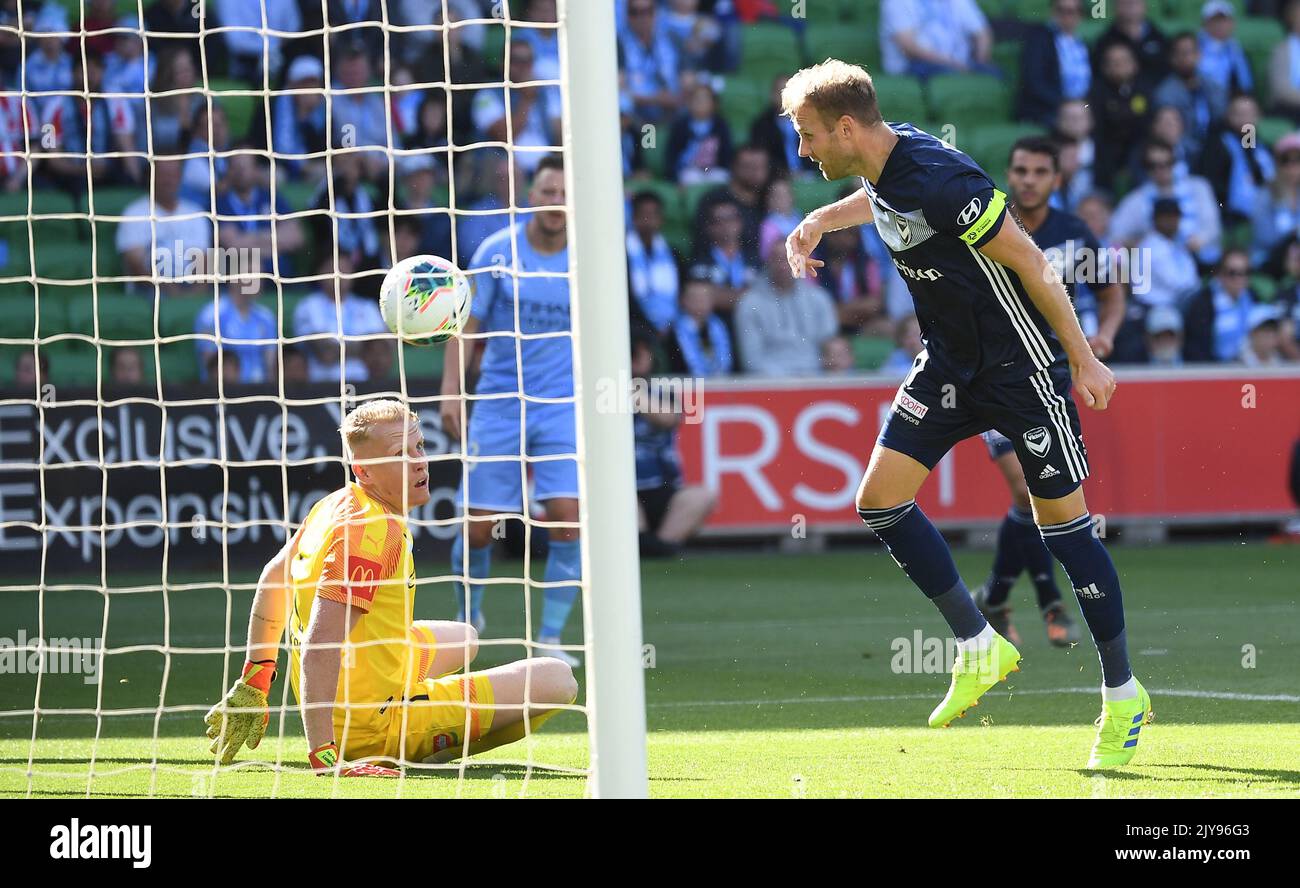 Nils Ola Toivonen of the Victory (right) heads his second goal past Tom ...