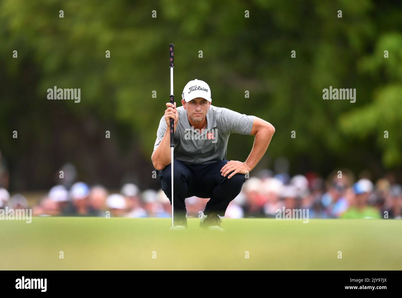 Australian golfer Adam Scott prepares to putt on the 18th before ...