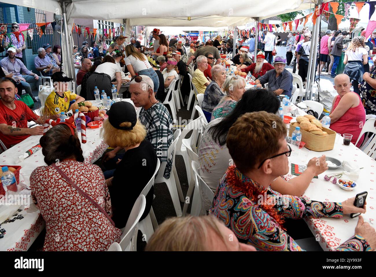 People are seen enjoying lunch during the annual Wayside Chapel ...