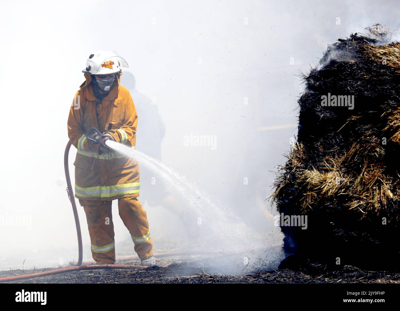 CFS members put out a fire which reached Hay bails on a property at ...