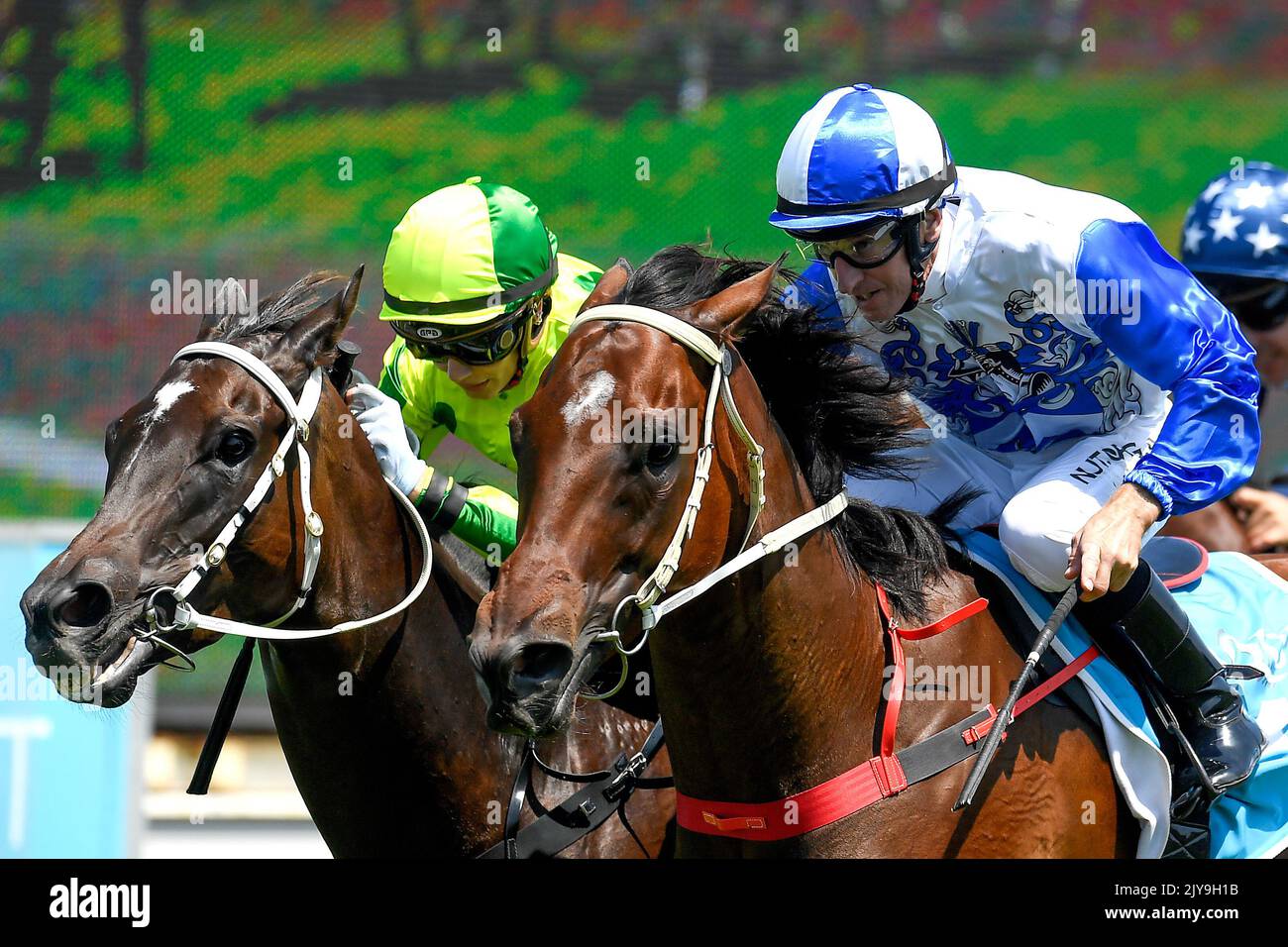 Jockey Andrew Spinks rides Ice Frost (right) to victory in race 2, the ...