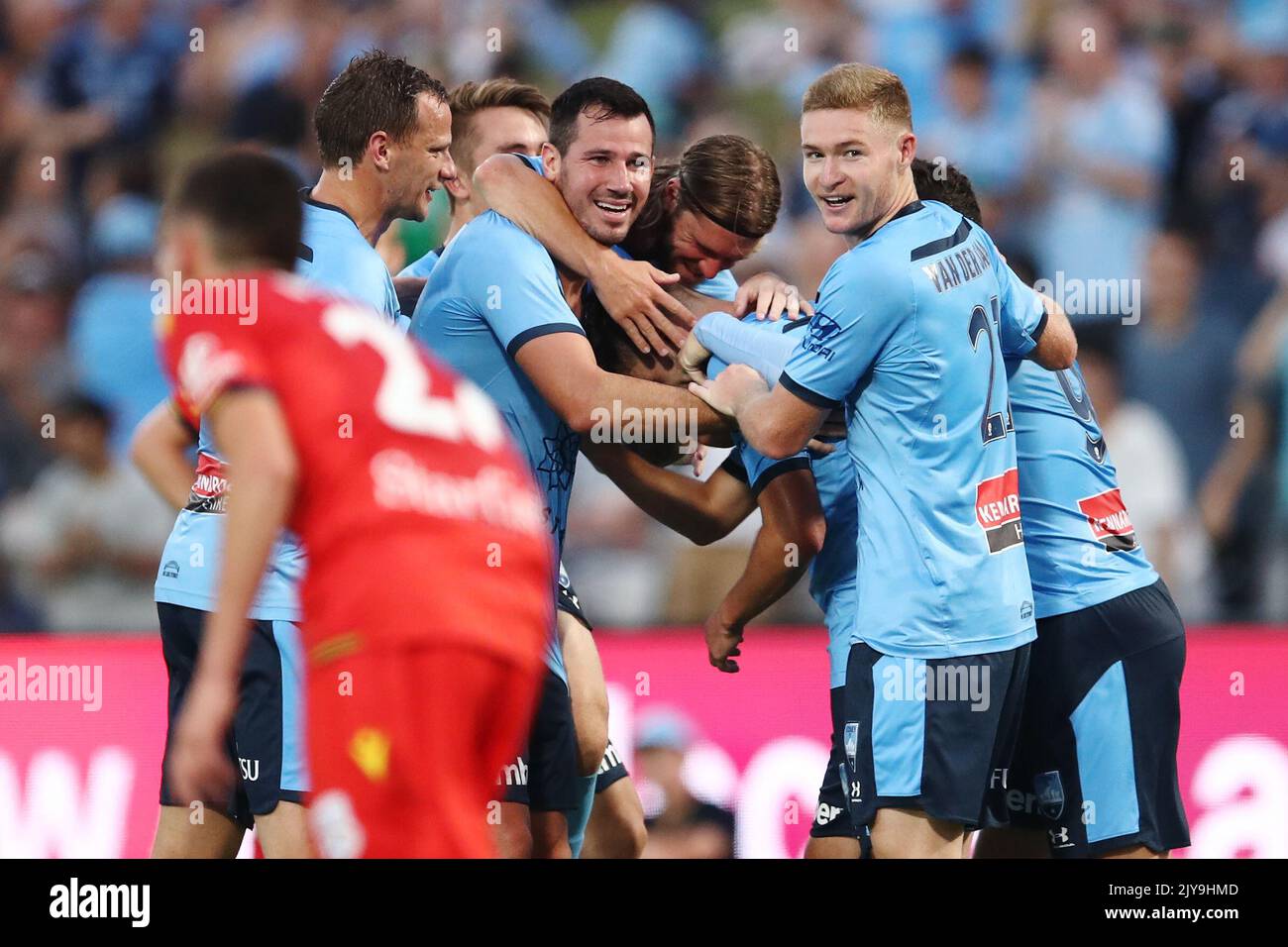 Paulo Retre of Sydney celebrates scoring a goal with team mates during ...