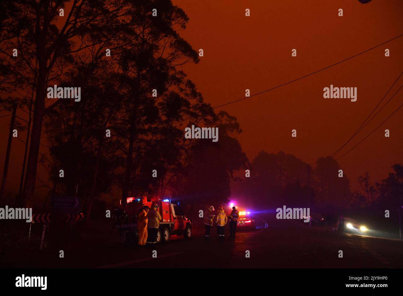 Rural Fire Service personnel at a roadblock near a bushfire in North ...
