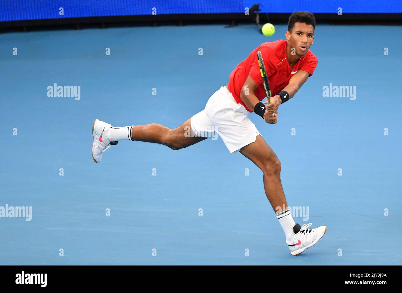 Felix Auger-Aliassime of Canada in action against John Millman of ...