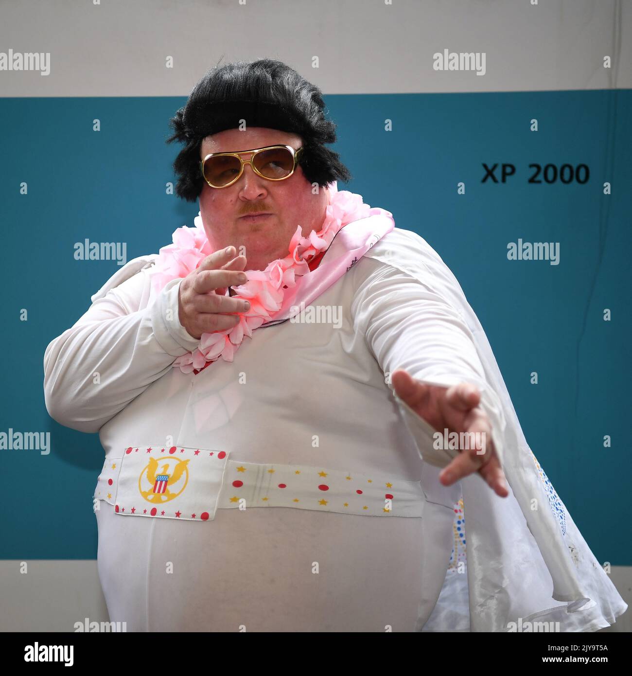 Elvis impersonator Sean Wright poses for a portrait prior to boarding ...