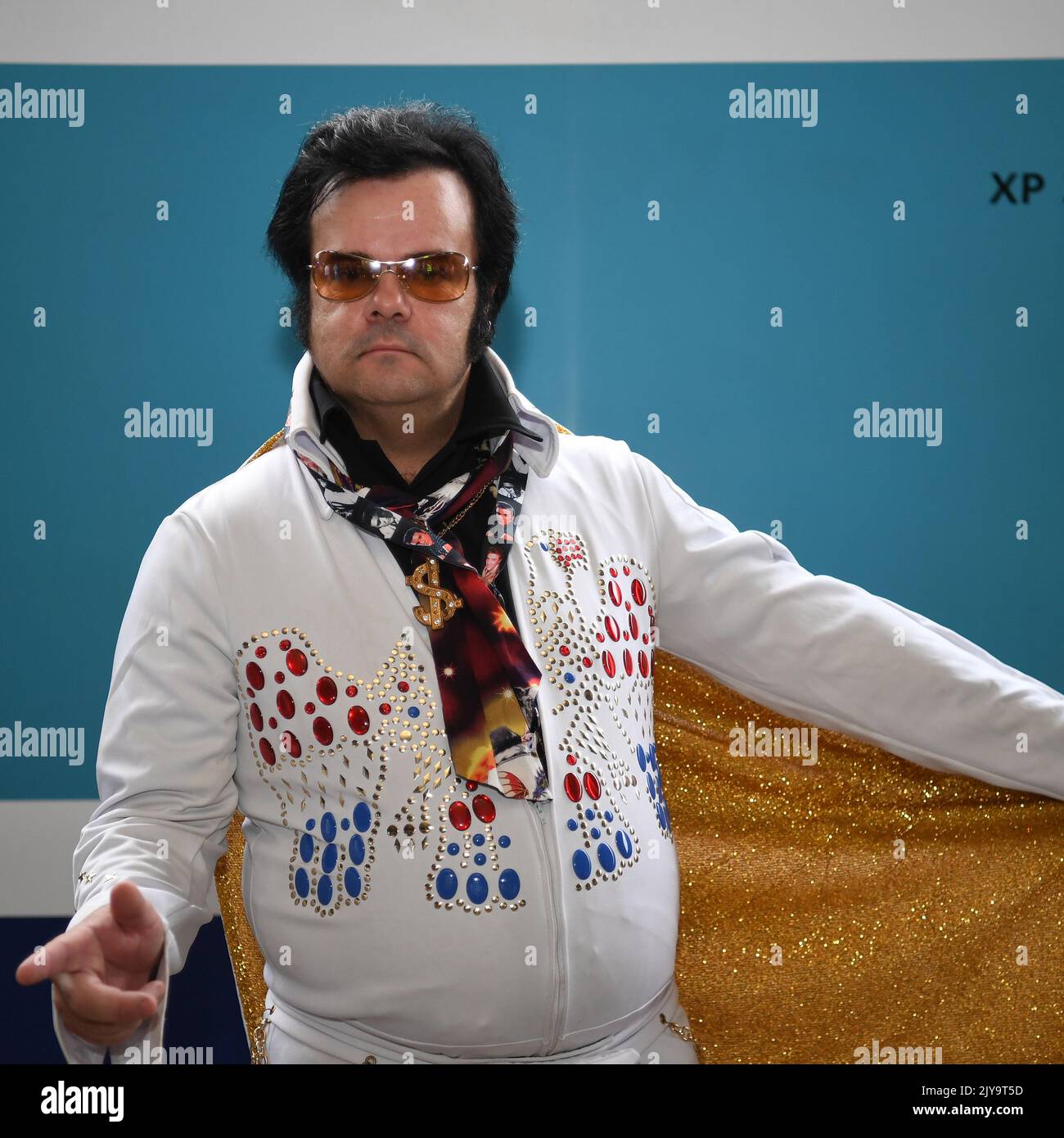 Elvis impersonator John Read prepares poses for a portrait prior to ...