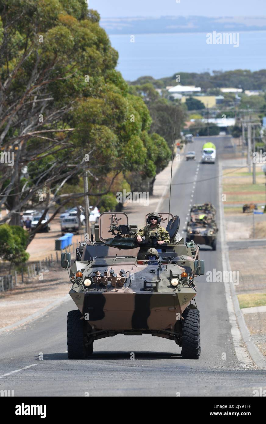 A convoy of Australian light armoured vehicles is seen in Kingscote on ...