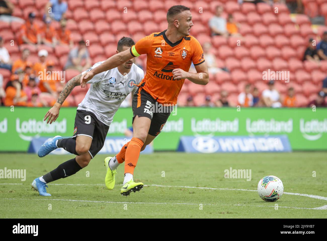 Thomas Aldred of the Roar and Jamie MacLaren of City compete for the ...